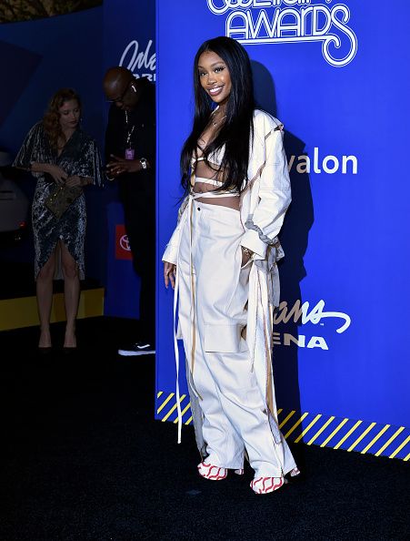 SZA Treats Fans To Another Sultry Photo Dump In A String Bikini