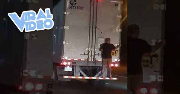 Viral Video: Man Clings to the Back of 18 Wheeler on Freeway